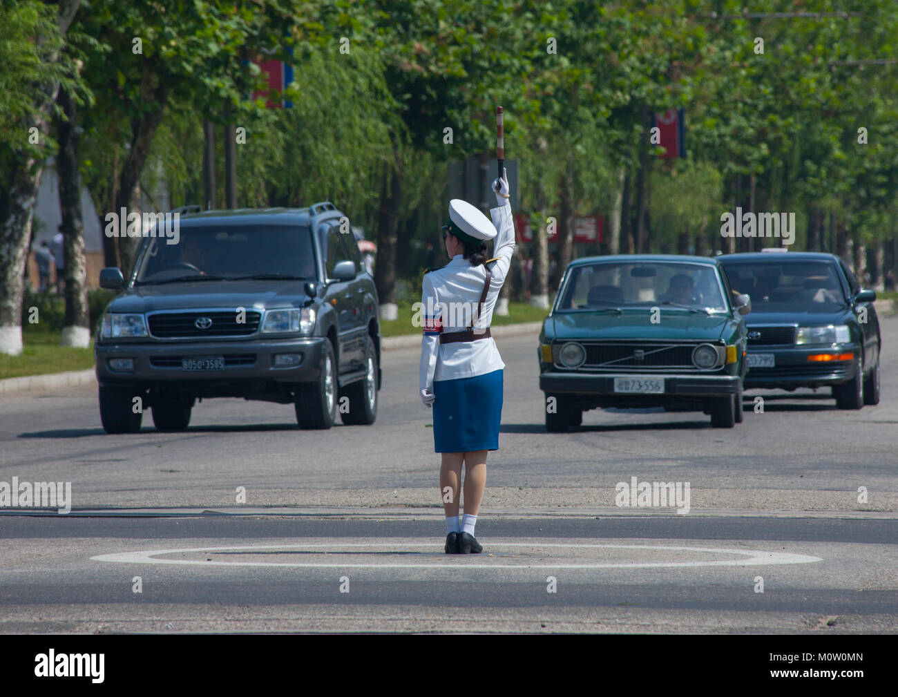North Korean female traffic security officer in white uniform in the ...
