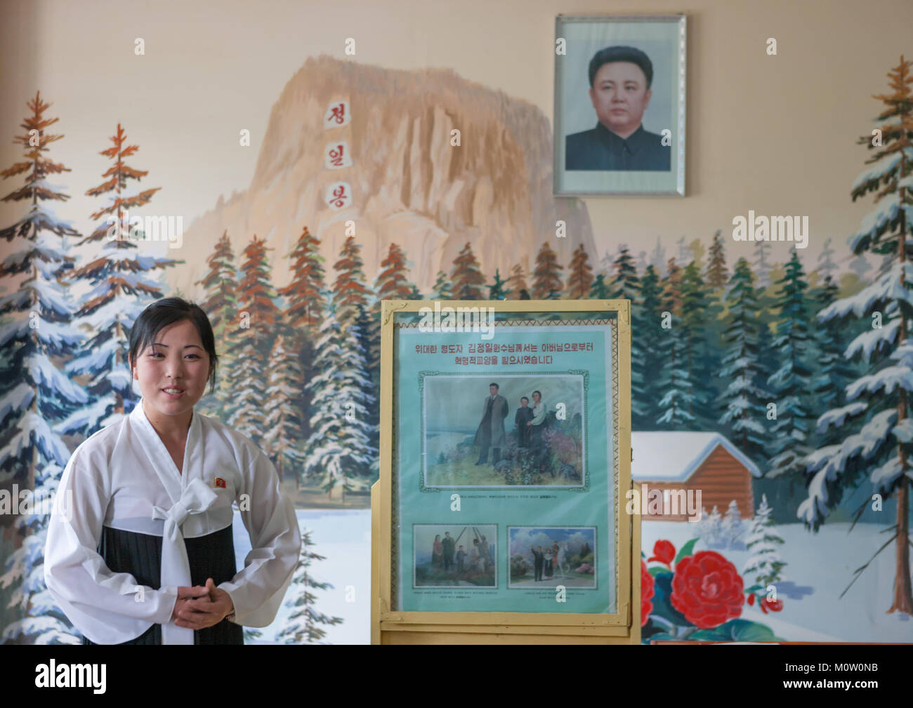 North Korean teacher in a classroom telling the life of Kim Jong il in ...