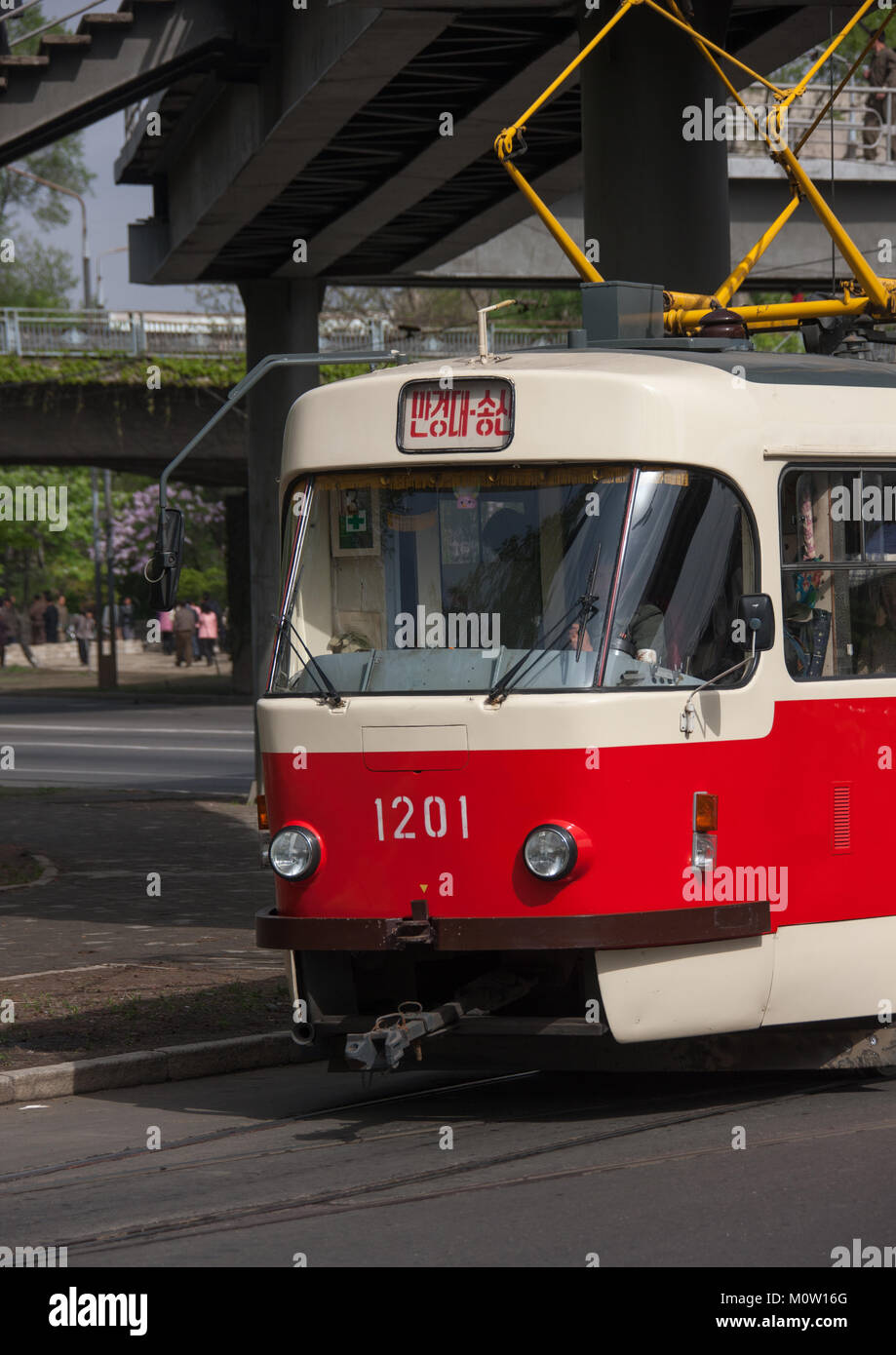 Red tramway in the street, Pyongan Province, Pyongyang, North Korea ...