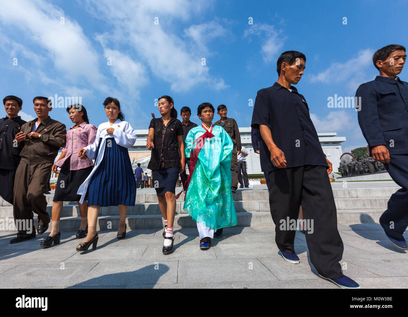 North Korean people in front of the statues of the Dear Leaders in ...