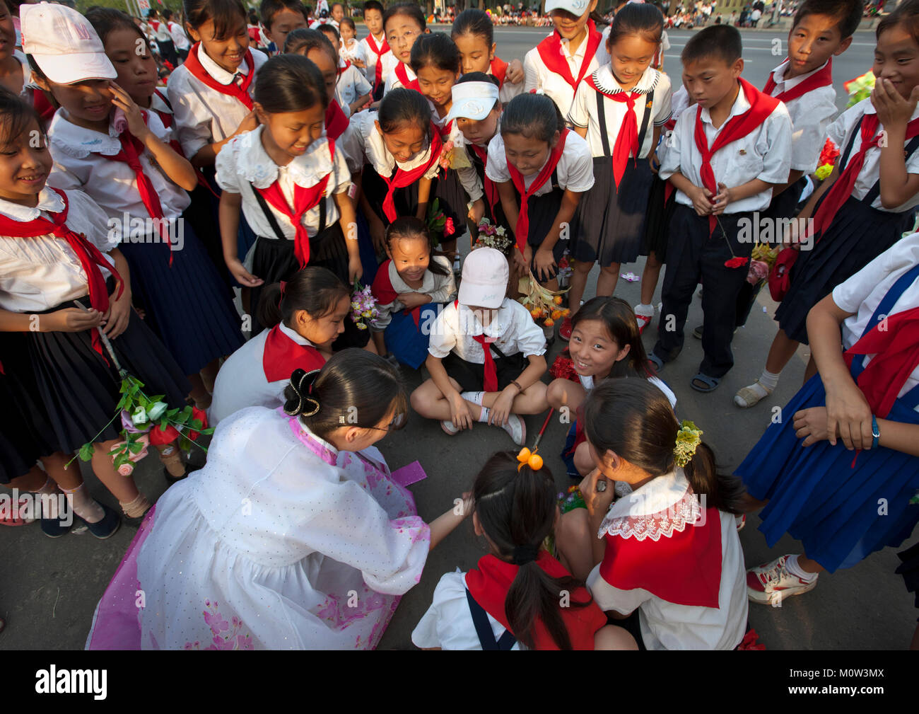 Smiling and laughing group of pioneers children in the street, Pyongan ...