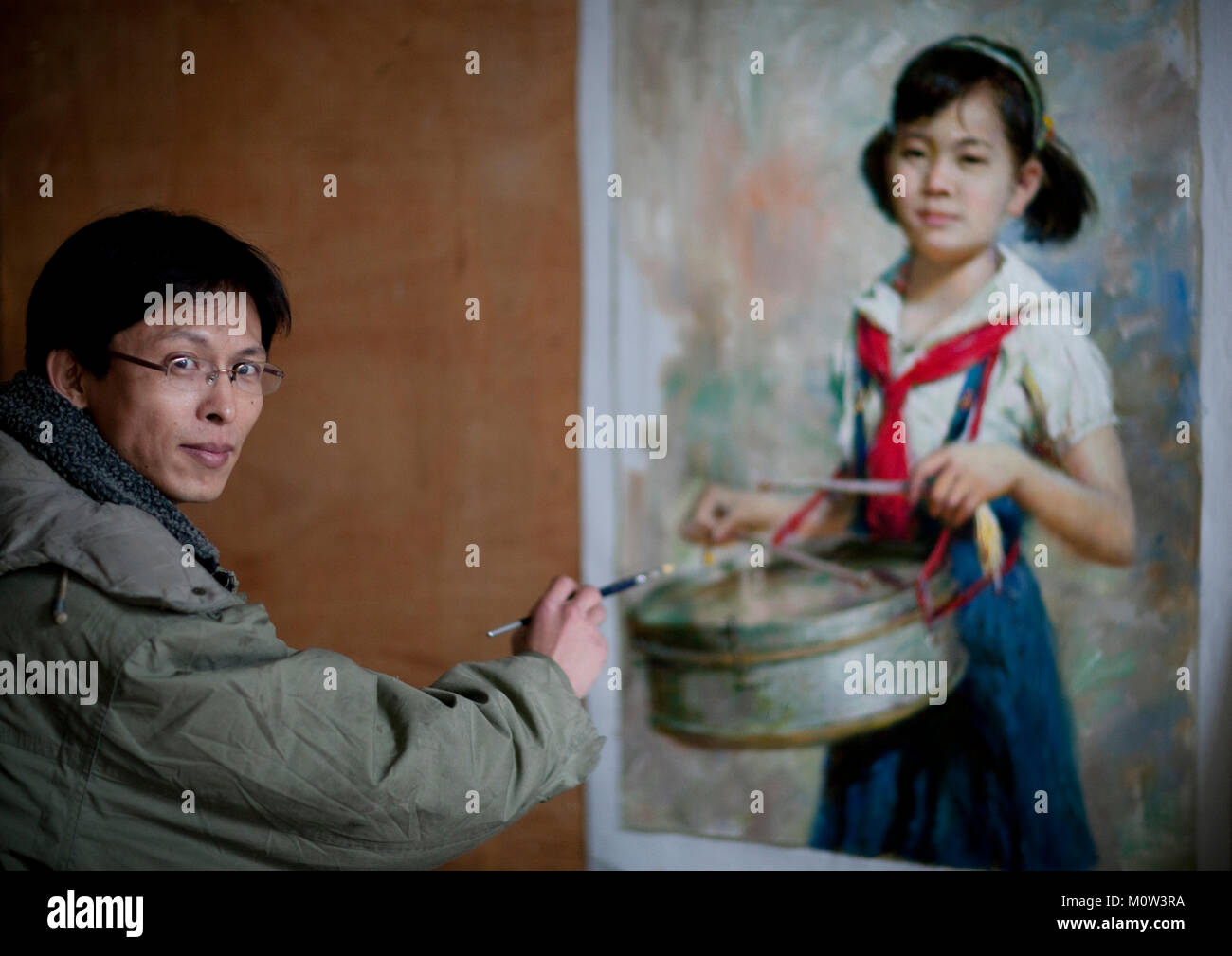 North Korean state artist painting a pioneer girl with a drum, Pyongan ...