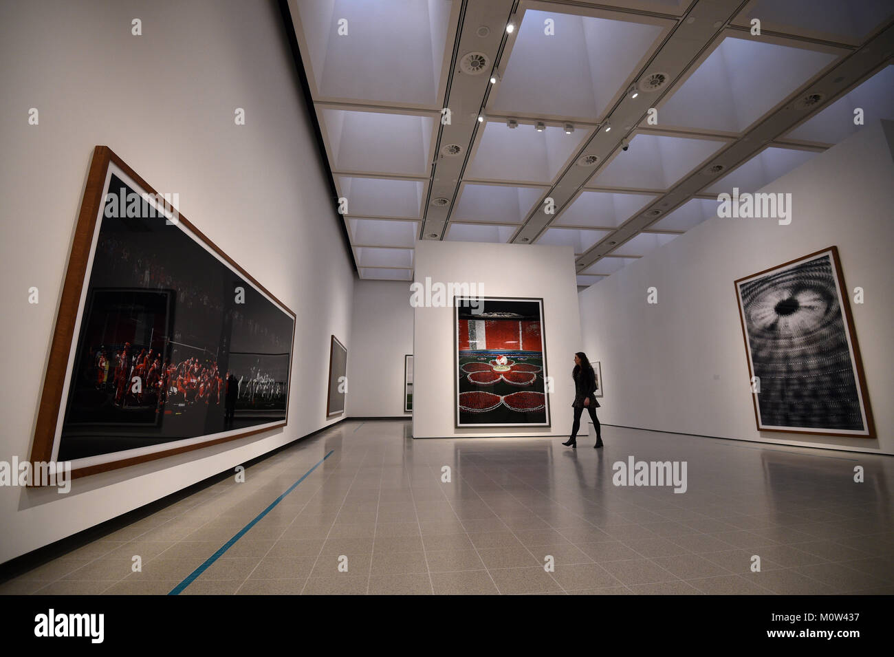 A visitor walks past Pyongyang VII (centre) by Andreas Gursky, at the ...