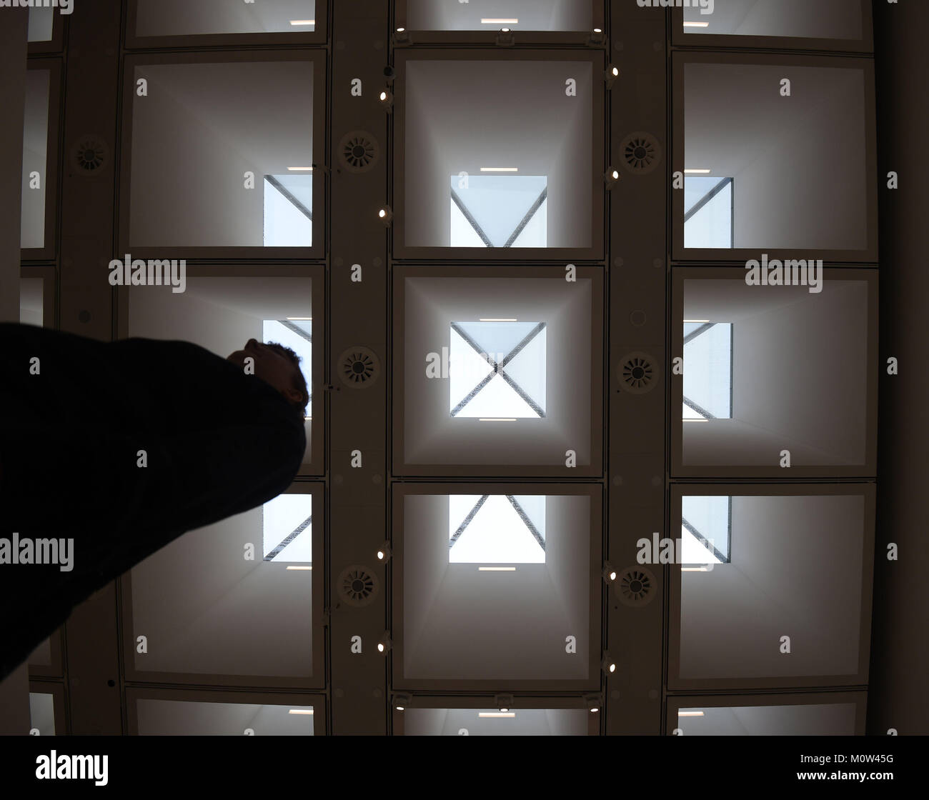 A visitor walks under the new glass pyramid roof at the Hayward Gallery ...