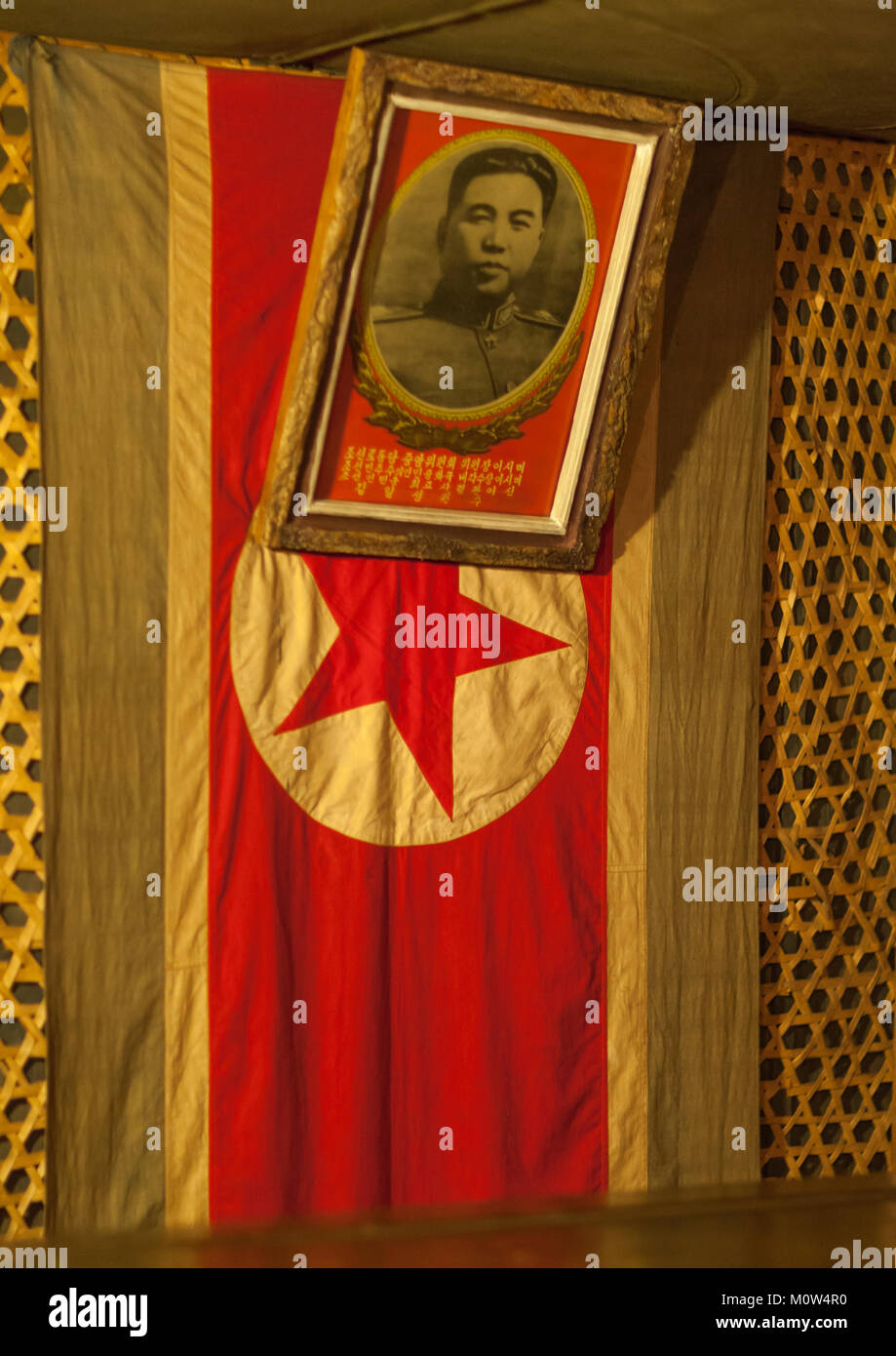 Kim Il-sung portrait and North Korean flag in the victorious fatherland ...