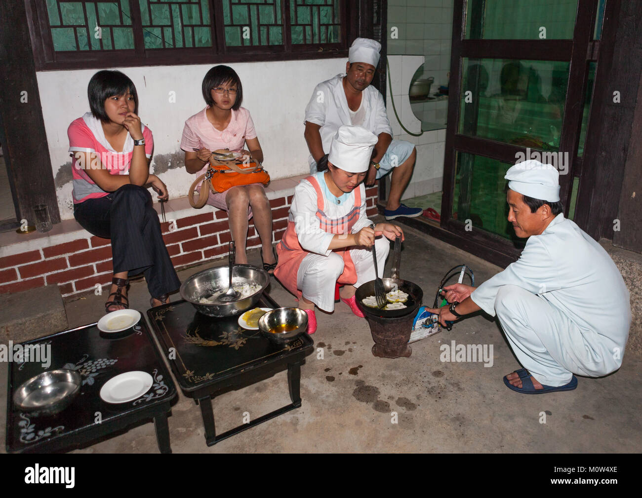 Cooks making traditional food in a restaurant, North Hwanghae Province ...