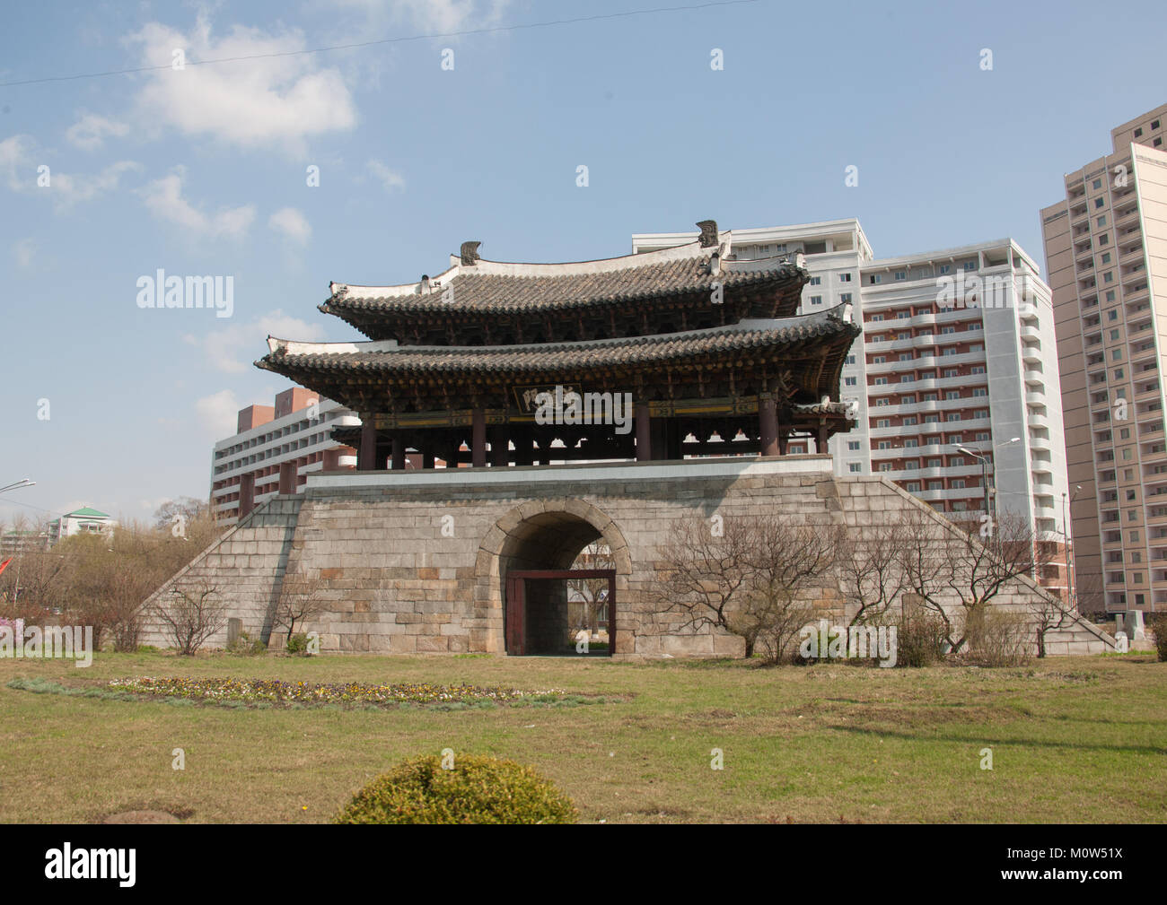 Old city gate in front of modern buildings, Pyongan Province, Pyongyang ...