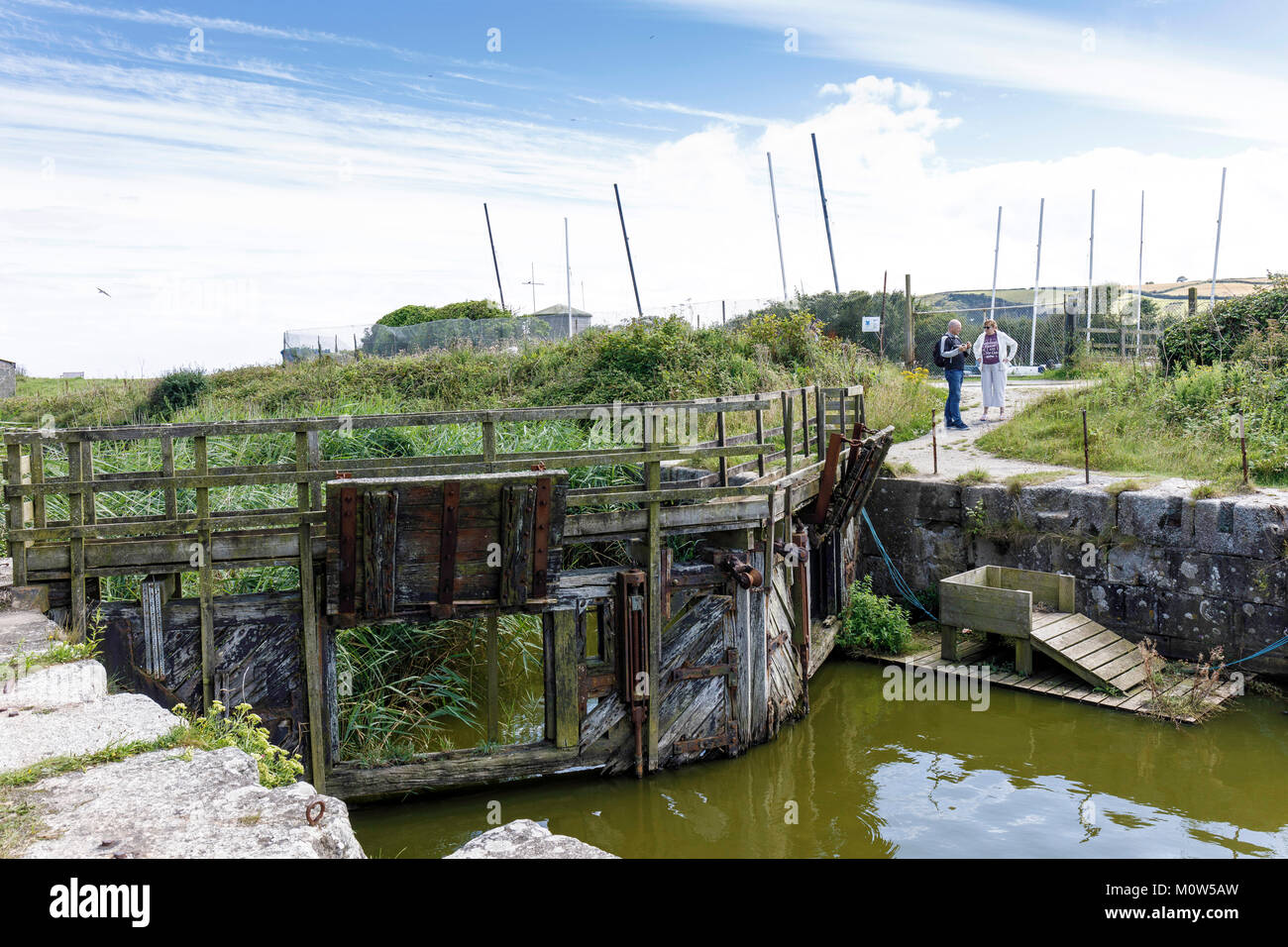 The decayed lock gates at the land locked silted up harbour of Pentewan ...