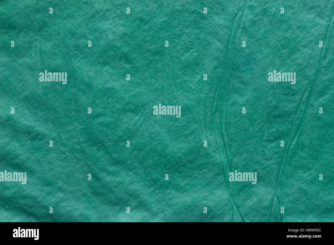 green color creased tissue paper bacground texture Stock Photo - Alamy