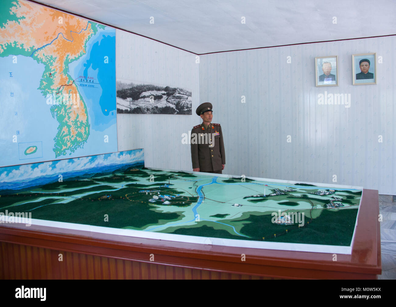 North Korean soldier in the joint security area in front of the map of ...