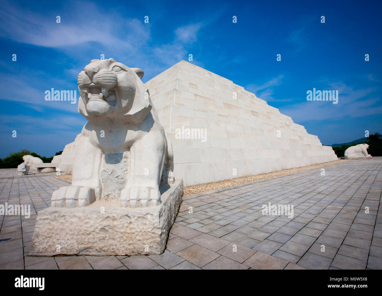 Tiger statue in front of the tomb of king tangun with a pyramid shape ...