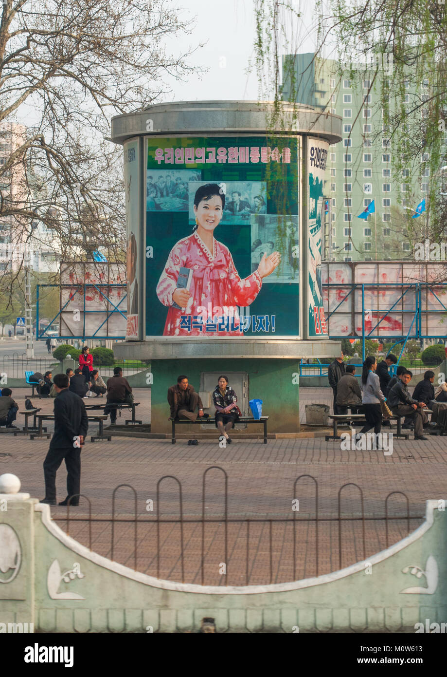 North Korean propaganda billboard on a square with the slogan let's ...