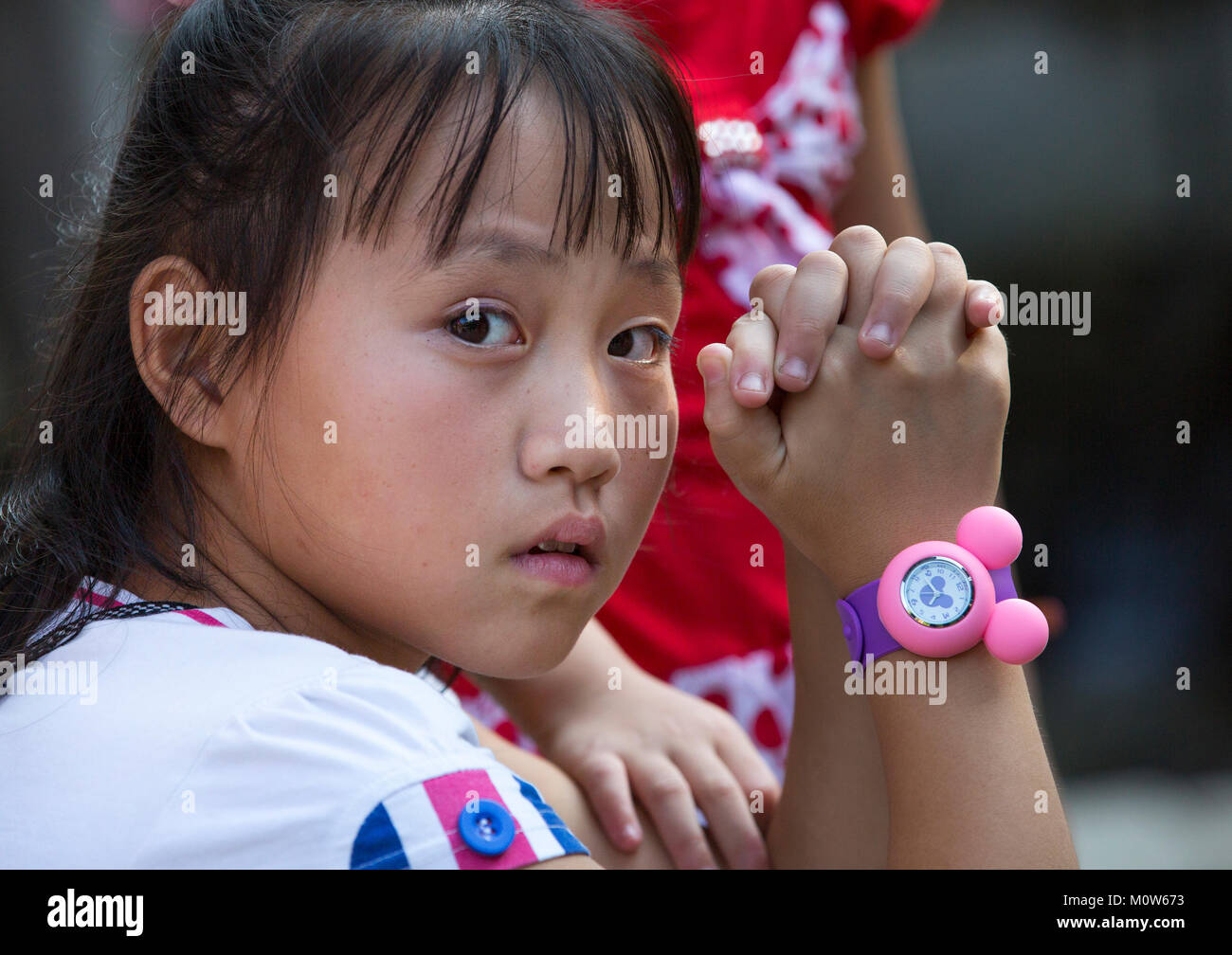 North Korean girl with a Mickey mouse watch, Pyongan Province ...