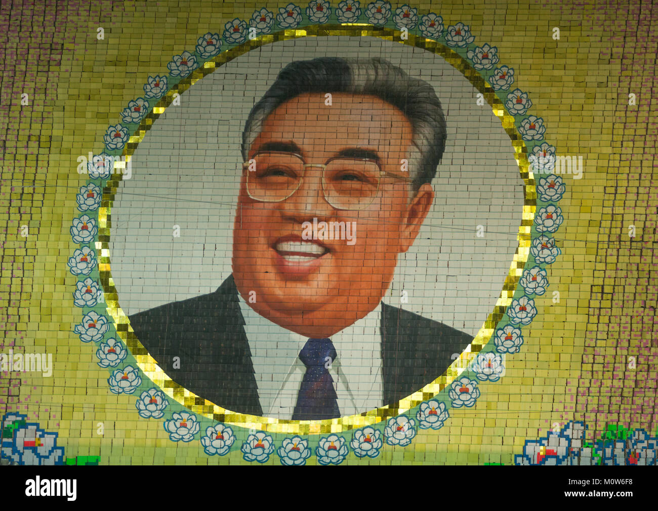 Kim il Sung portrait made by children pixels holding up colored boards ...