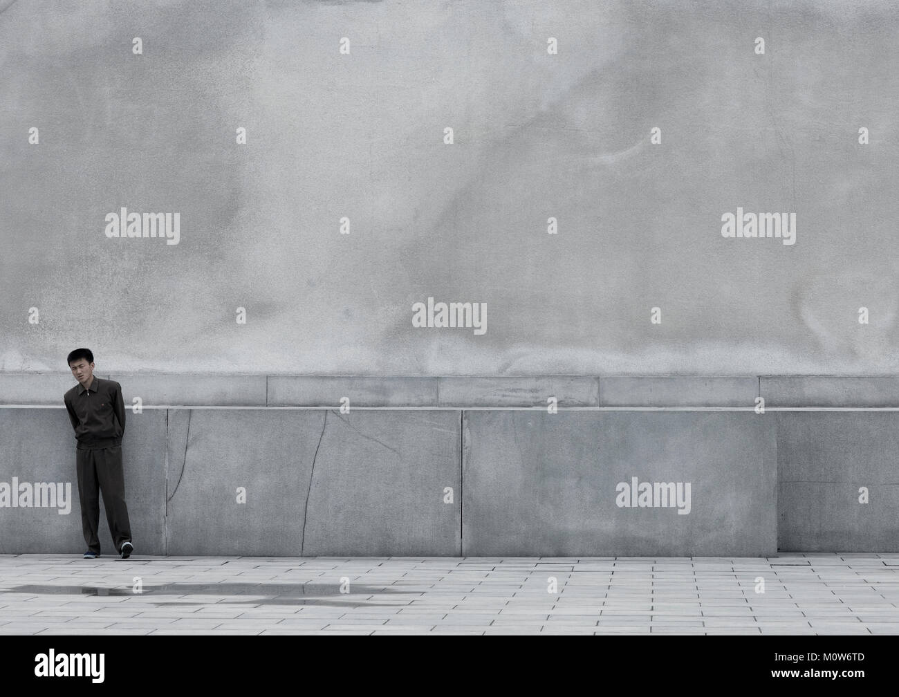 North Korean man standing at the bottom of Juche tower, Pyongan ...