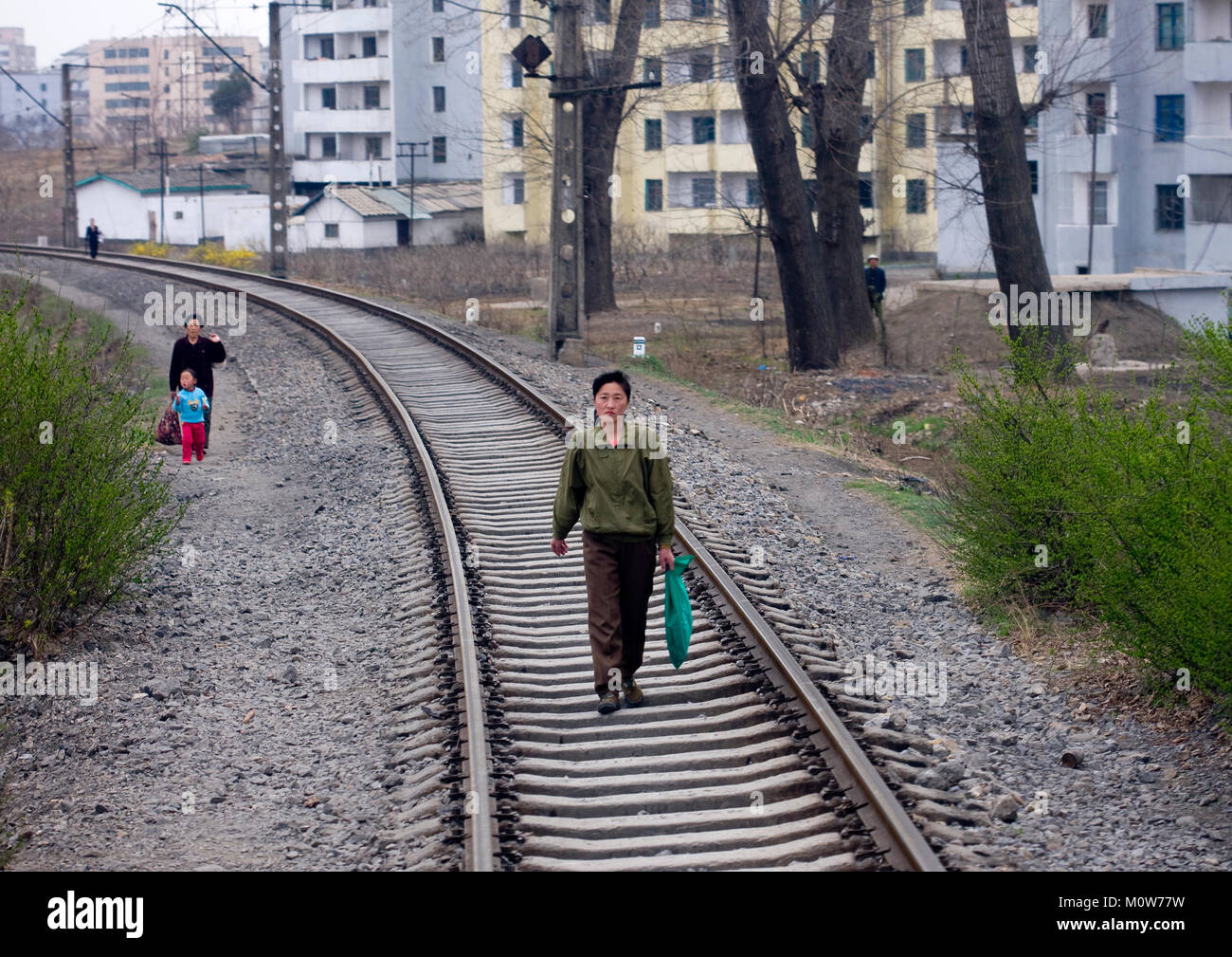 North Korean woman walking on empty railways, Pyongan Province ...