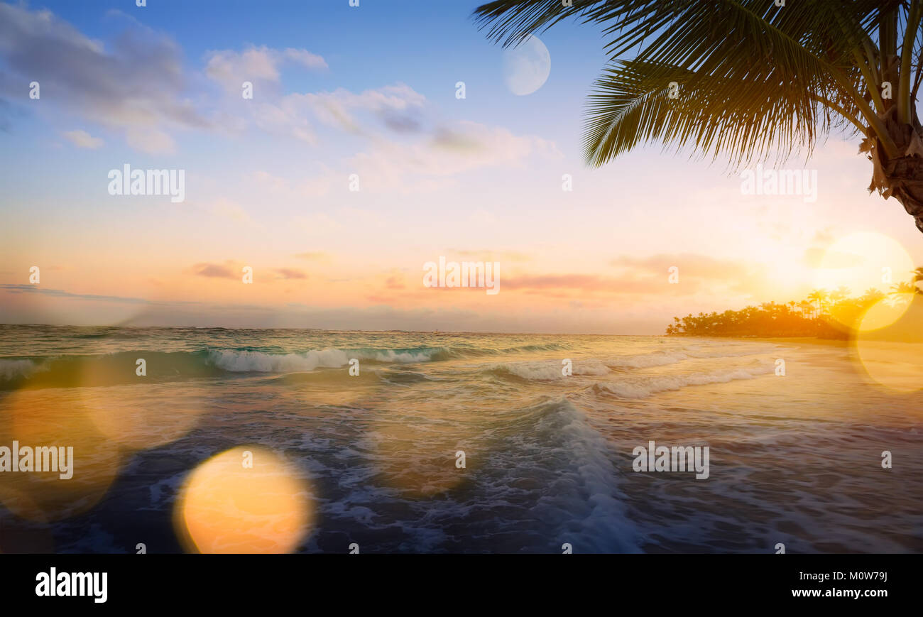 Art Beautiful sunrise over the tropical beach Stock Photo - Alamy