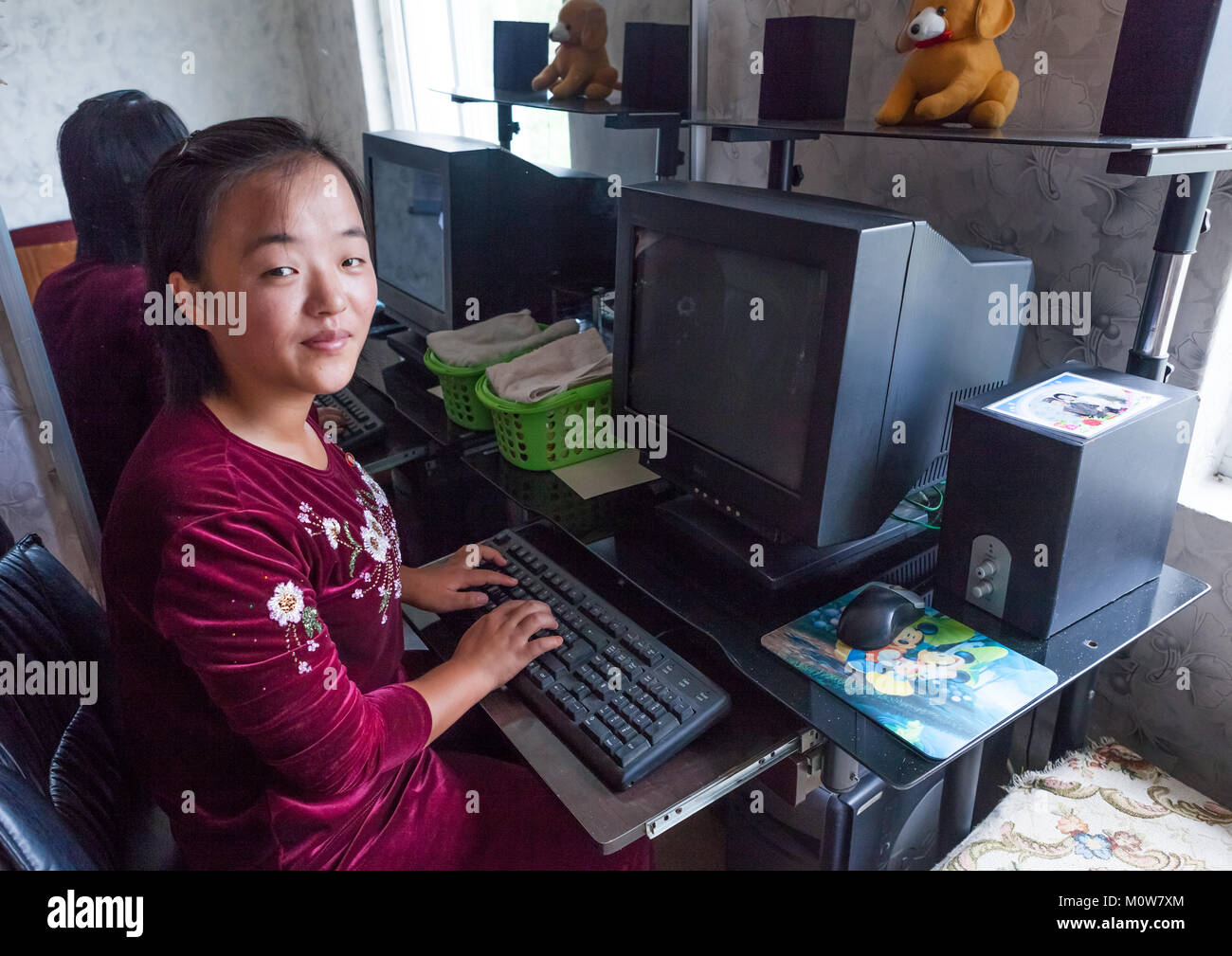 Portrait of a North Korean girl using a computer without electricty ...