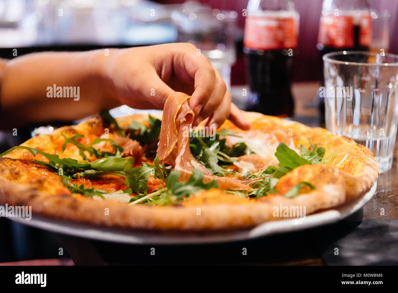 Hand take pizza hi-res stock photography and images - Alamy