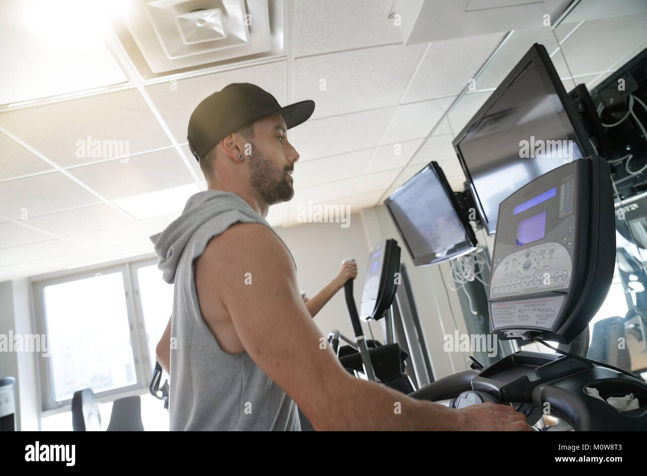 Man walking on treadmill at the gym Stock Photo - Alamy