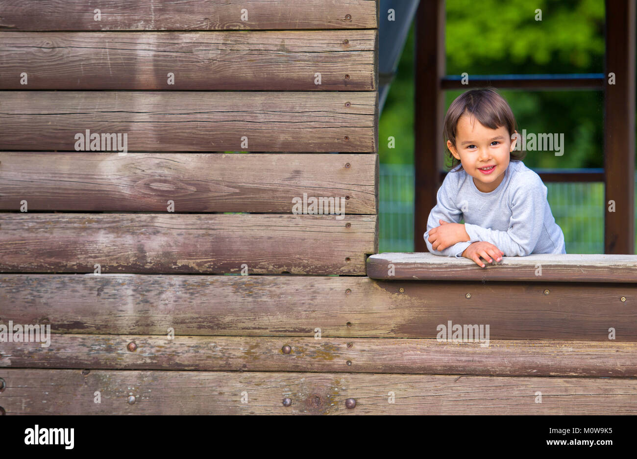 Happy little girl smiling at the camera Stock Photo - Alamy