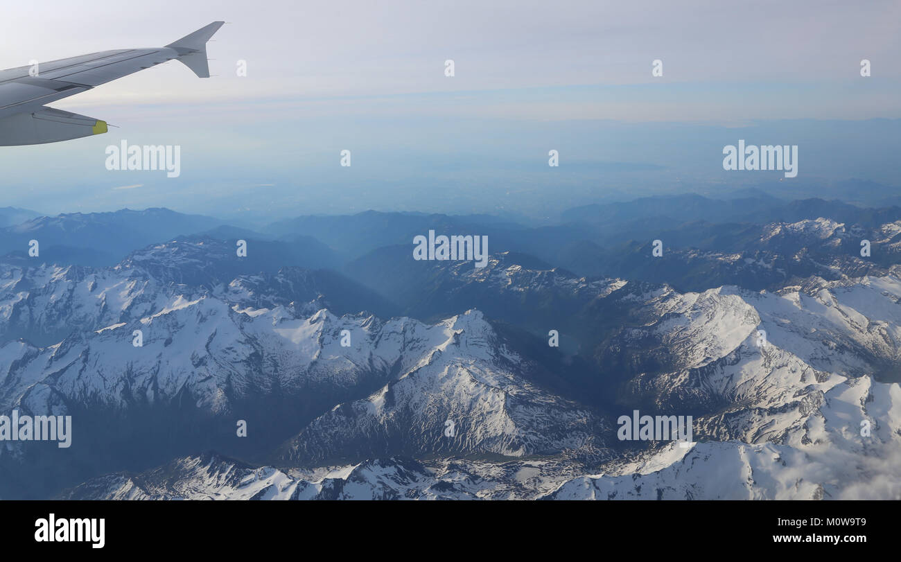 Snow-capped mountain peaks of the Alps to the altitude of the aircraft ...
