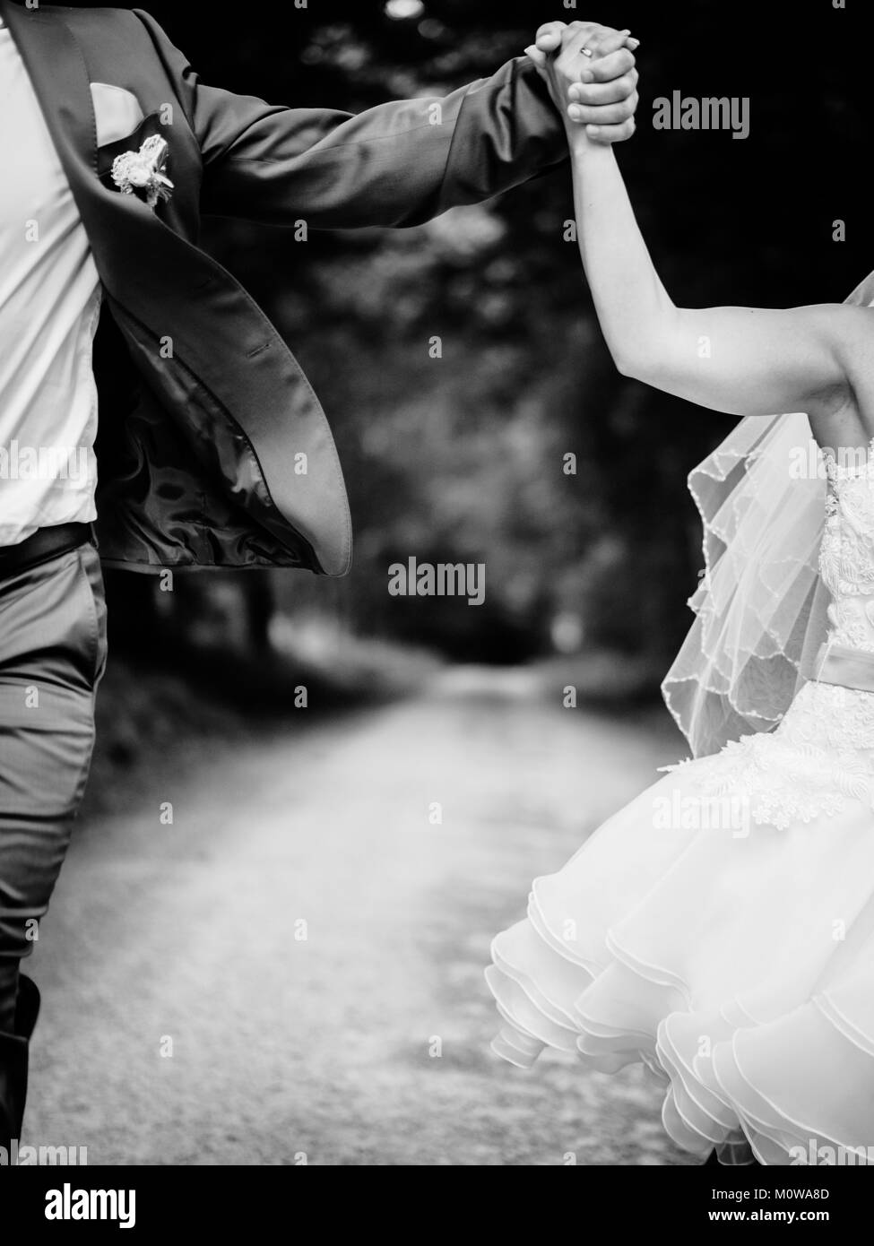 Man holding black orange Black and White Stock Photos & Images - Alamy