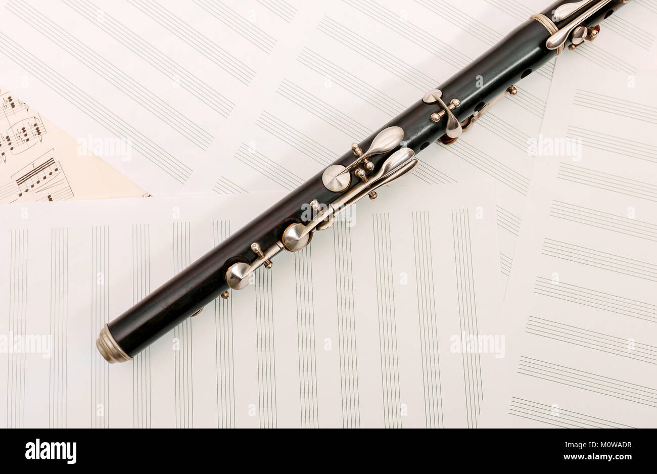 transverse flute on sheet music Stock Photo - Alamy