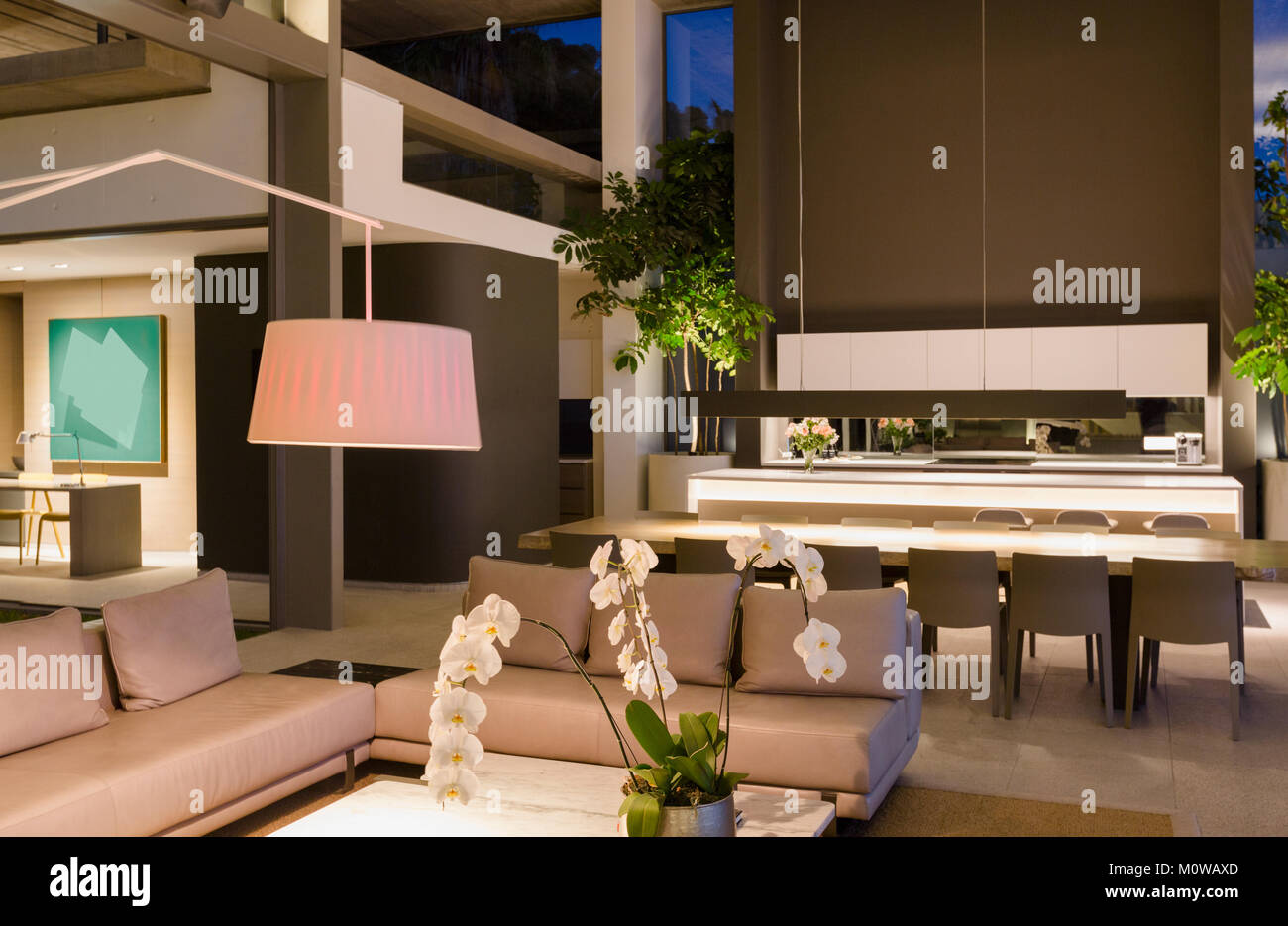 Illuminated modern, luxury home showcase interior living room and ...