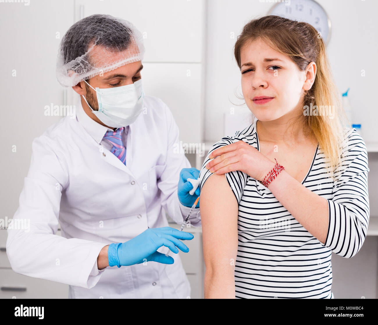 Teenager and doctor consulting room hi-res stock photography and images ...