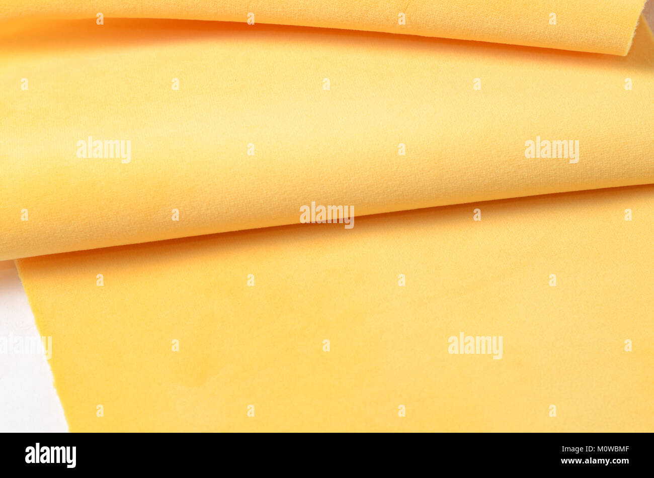 Bright yellow velour textile. Fabric texture background Stock Photo - Alamy