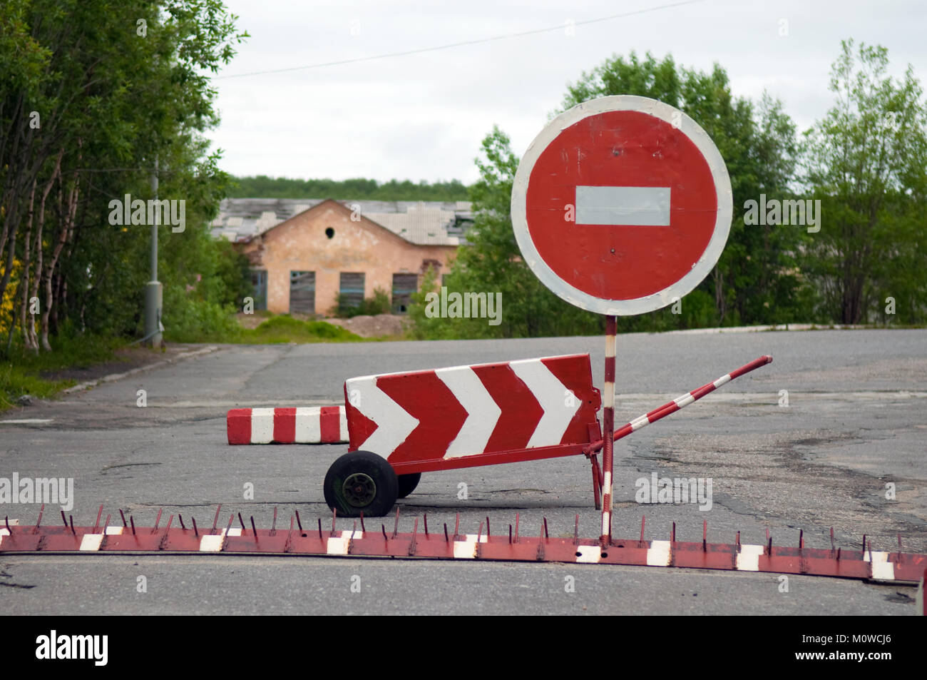 Forbidden fence and a road sign "No Entry Stock Photo - Alamy