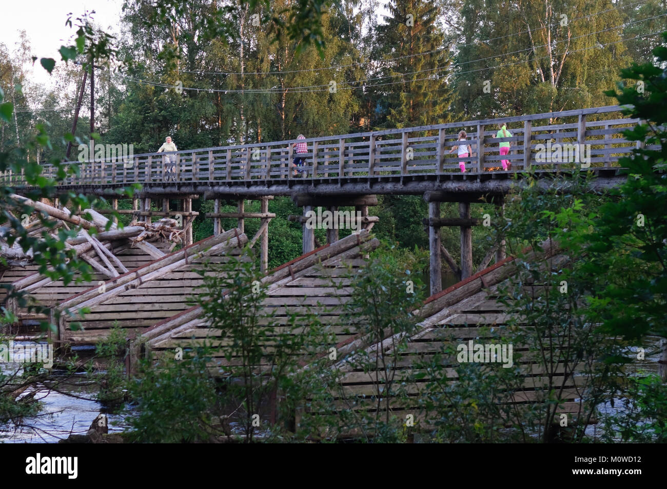 Pedestrian wooden bridge over the river Olonka Stock Photo - Alamy