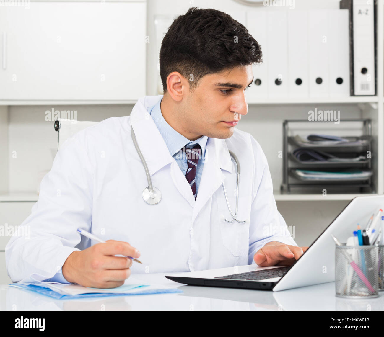 Young therapist doing report hi-res stock photography and images - Alamy