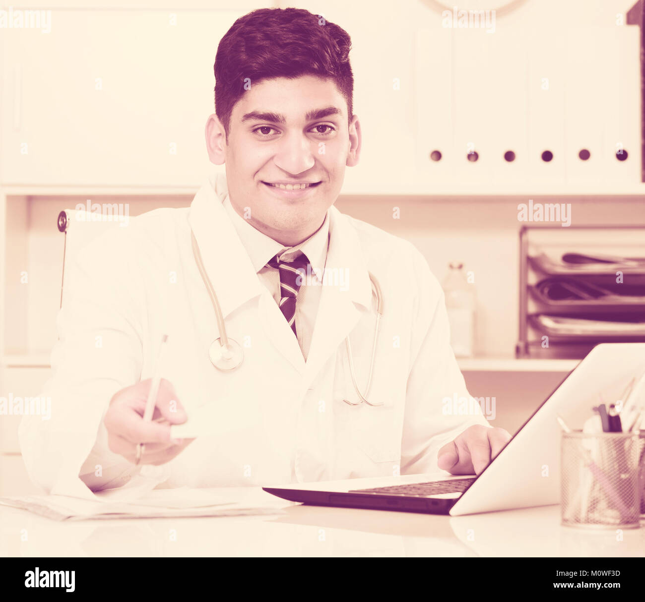 Male doctor is giving the conclusion about health of client in clinic ...