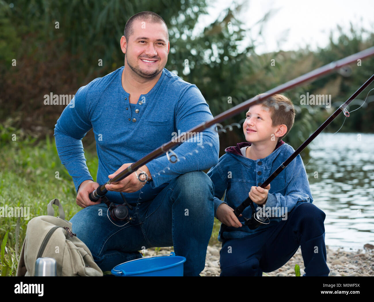 Father boy fishing rods hi-res stock photography and images - Alamy