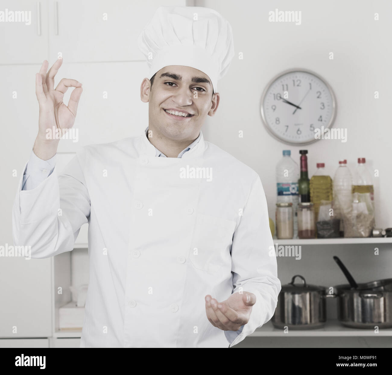 Male cook is demonstrating emotions about flavor spectrum of dishes on ...