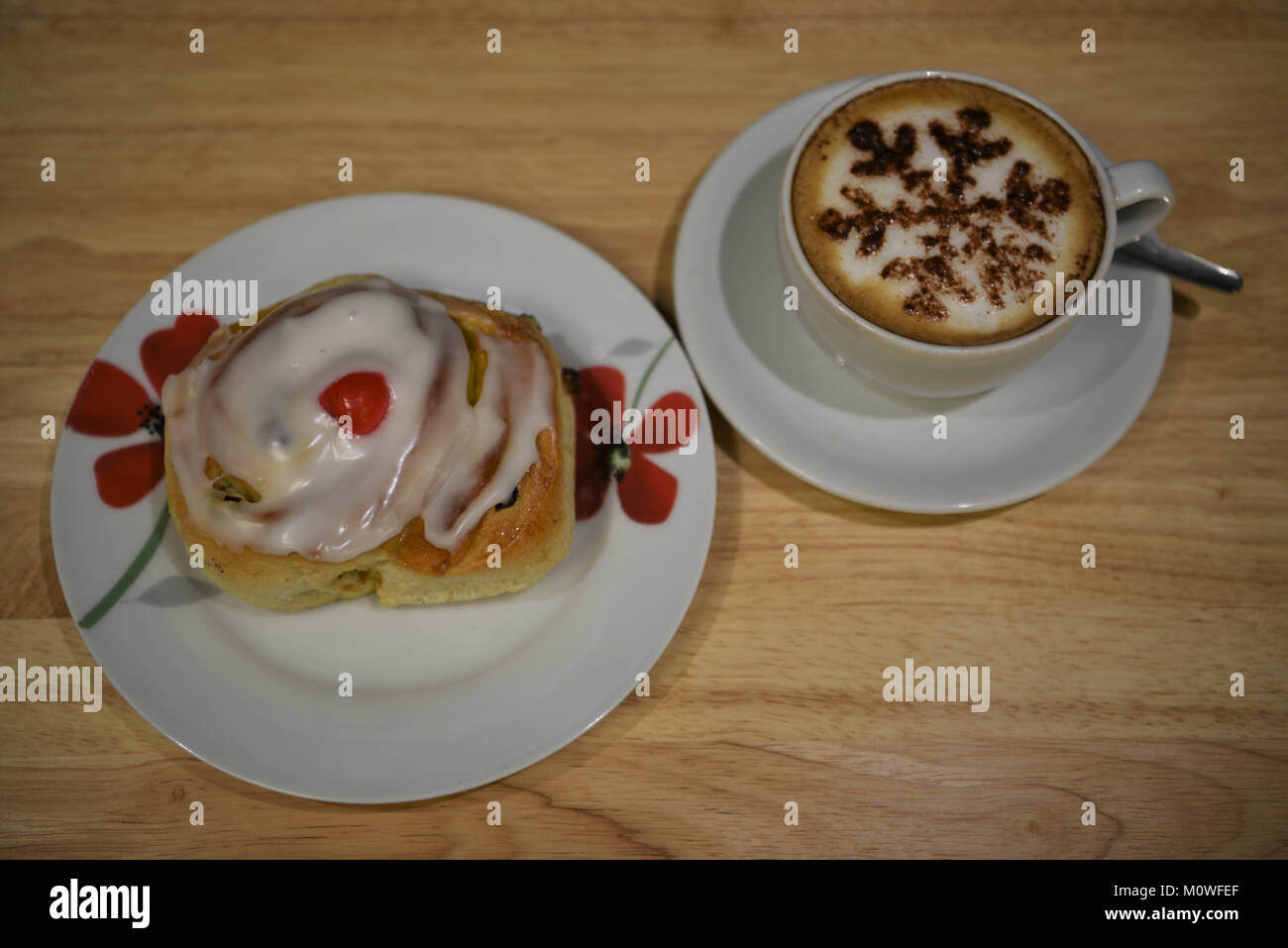 food photography with overhead view of an iced fruit Belgian bun cake ...