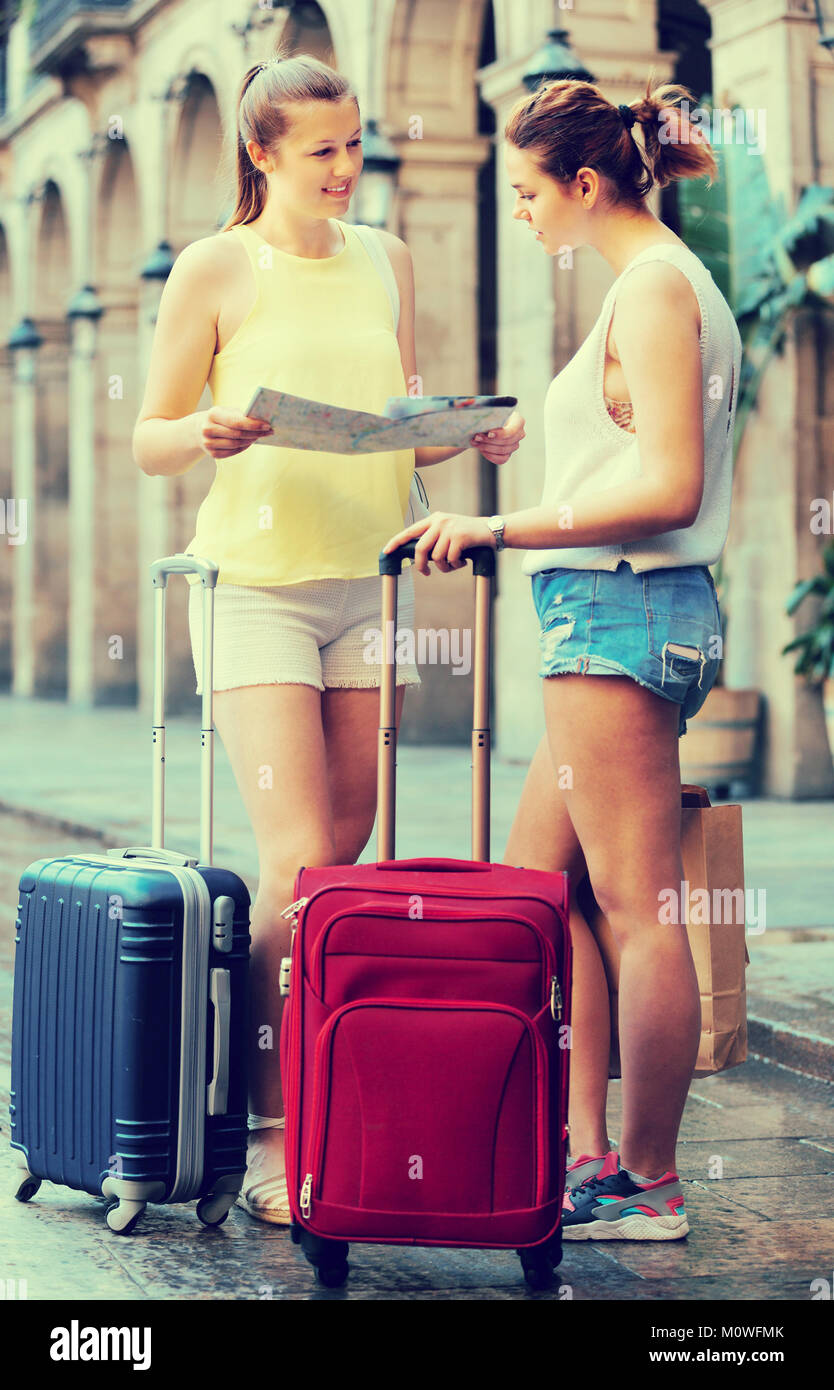 Women are paving the route on a map for walking while journey Stock ...