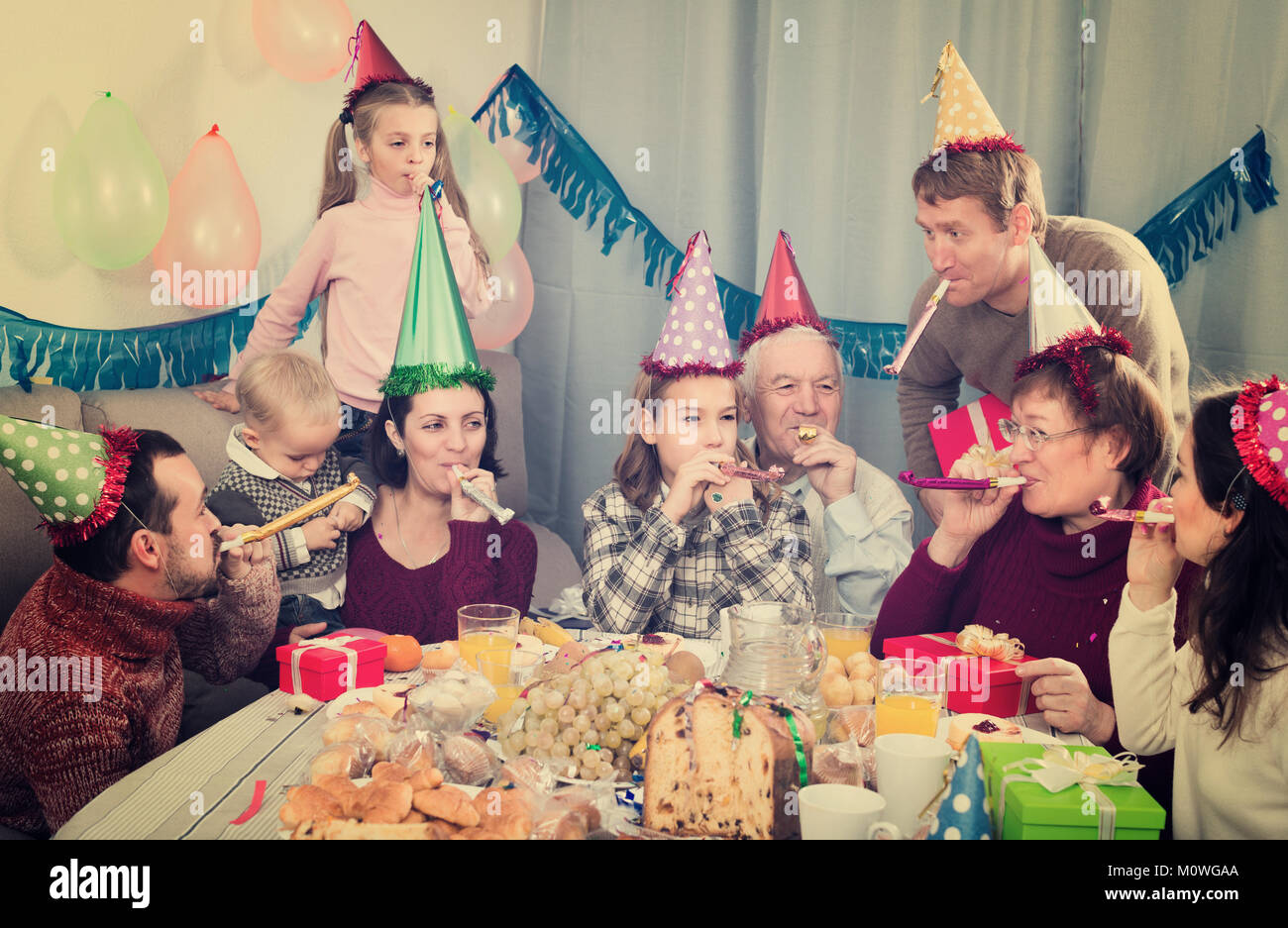 Family with children are having good time during children’s birthday ...