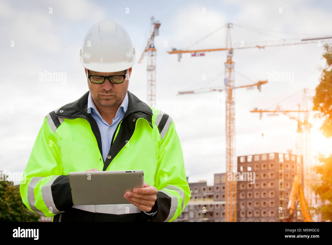 Construction engineer wearing safety vest Stock Photo - Alamy