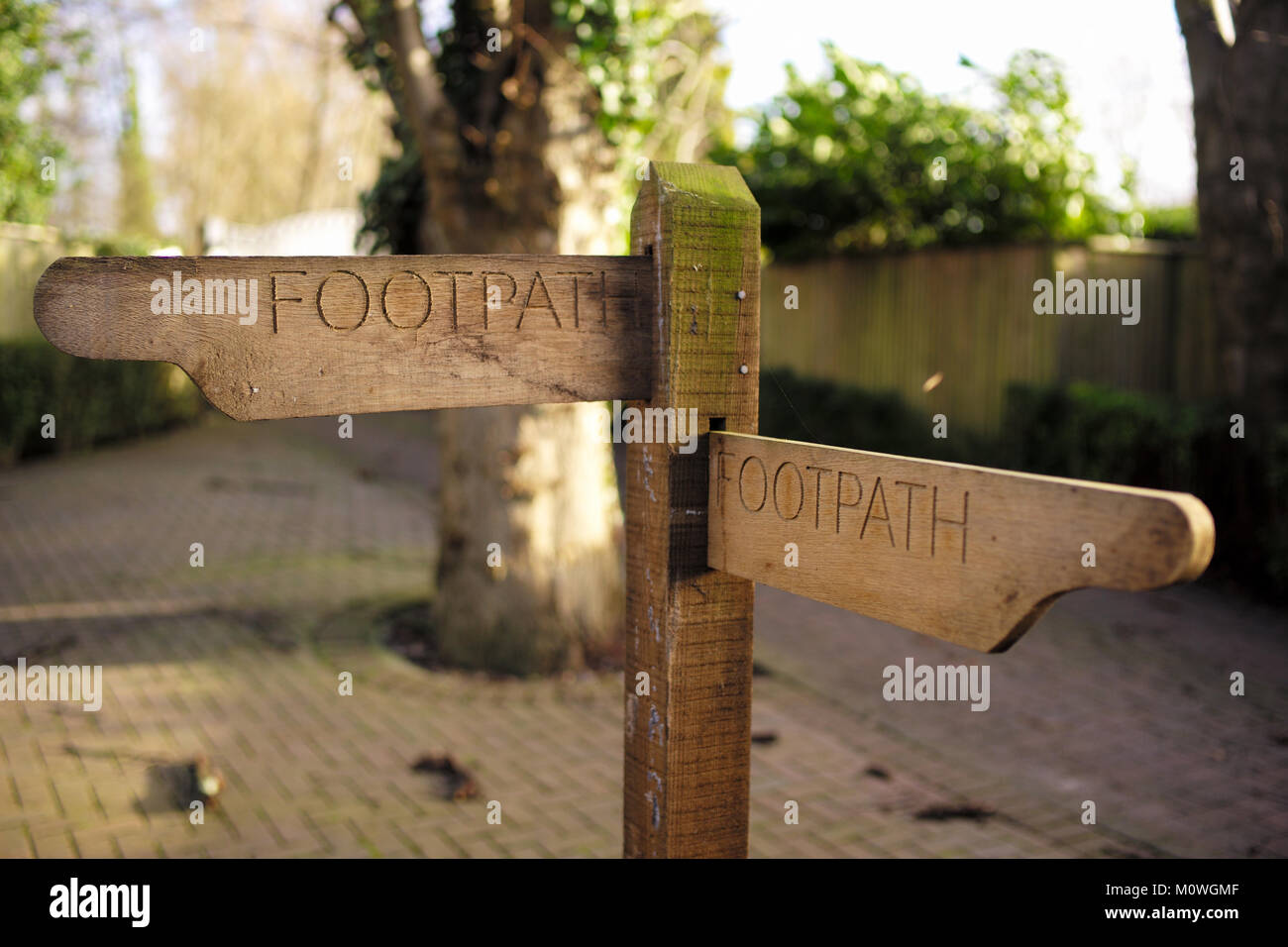 A double modern wooden footpath direction sign located in Romsey ...