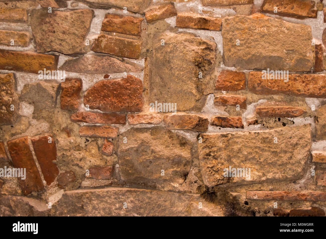 Old and irregular brick wall background with cement Stock Photo - Alamy