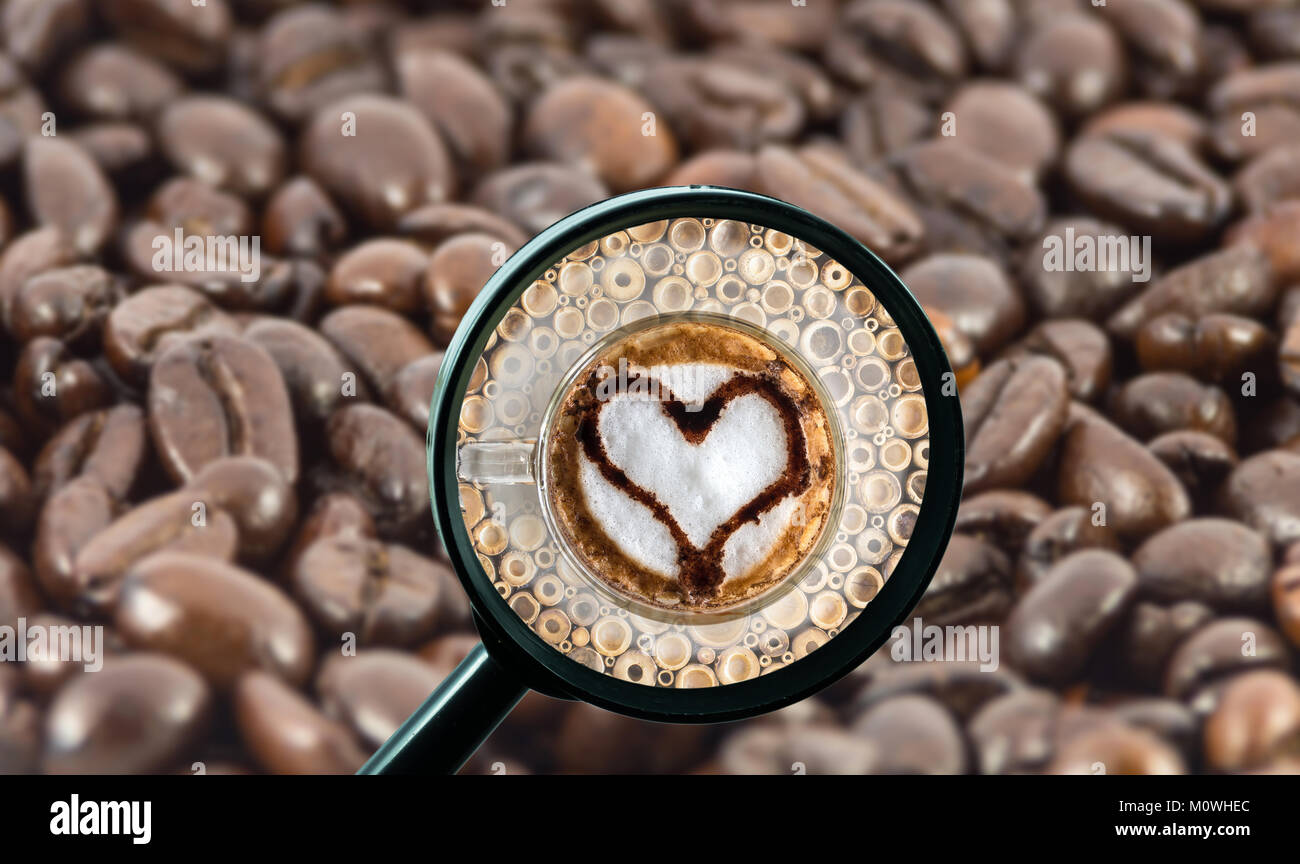 magnifying glass with background of roasted coffee beans to be coffee ...