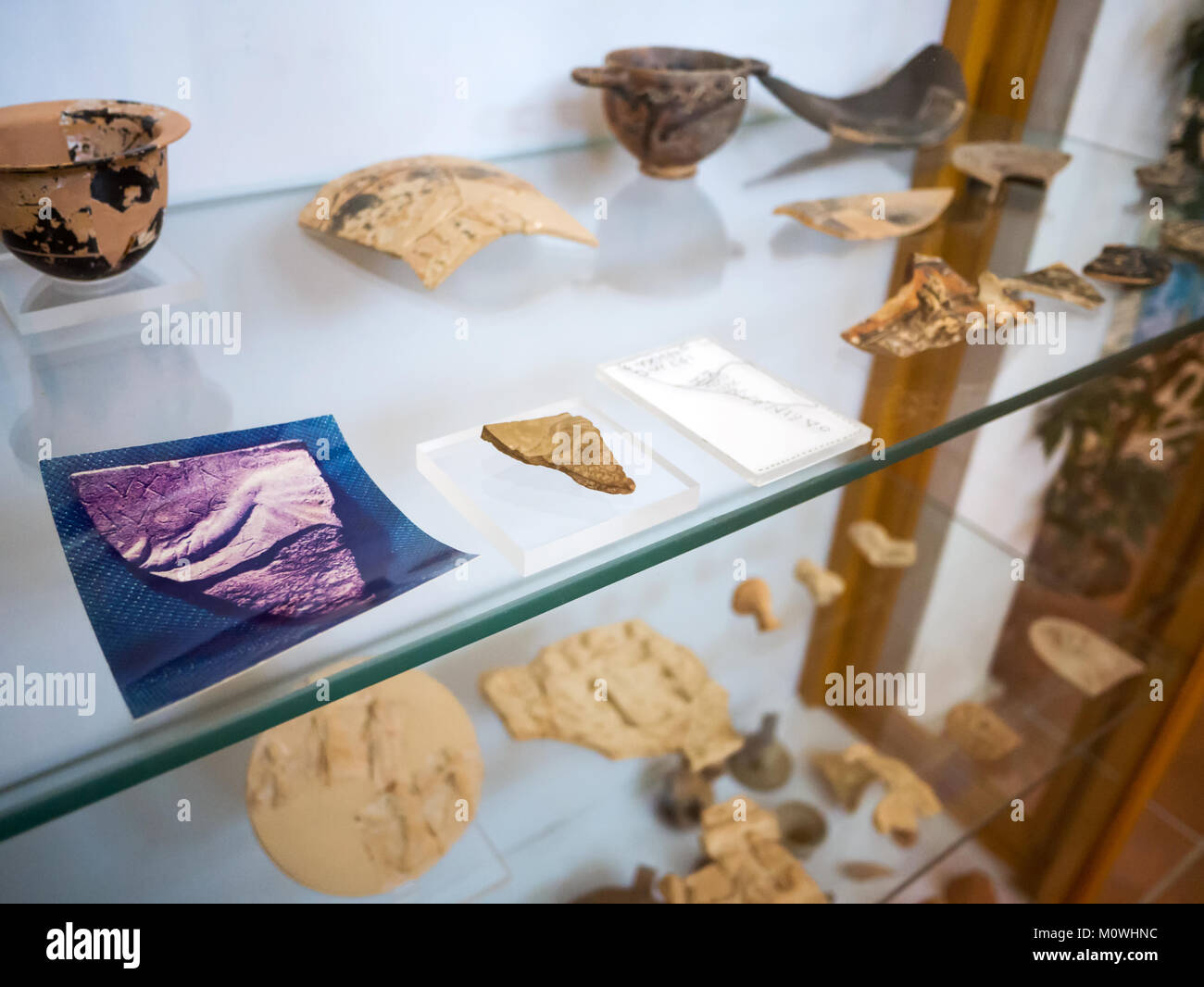 small ancient artifacts from the period of odysseus found inside a cave ...