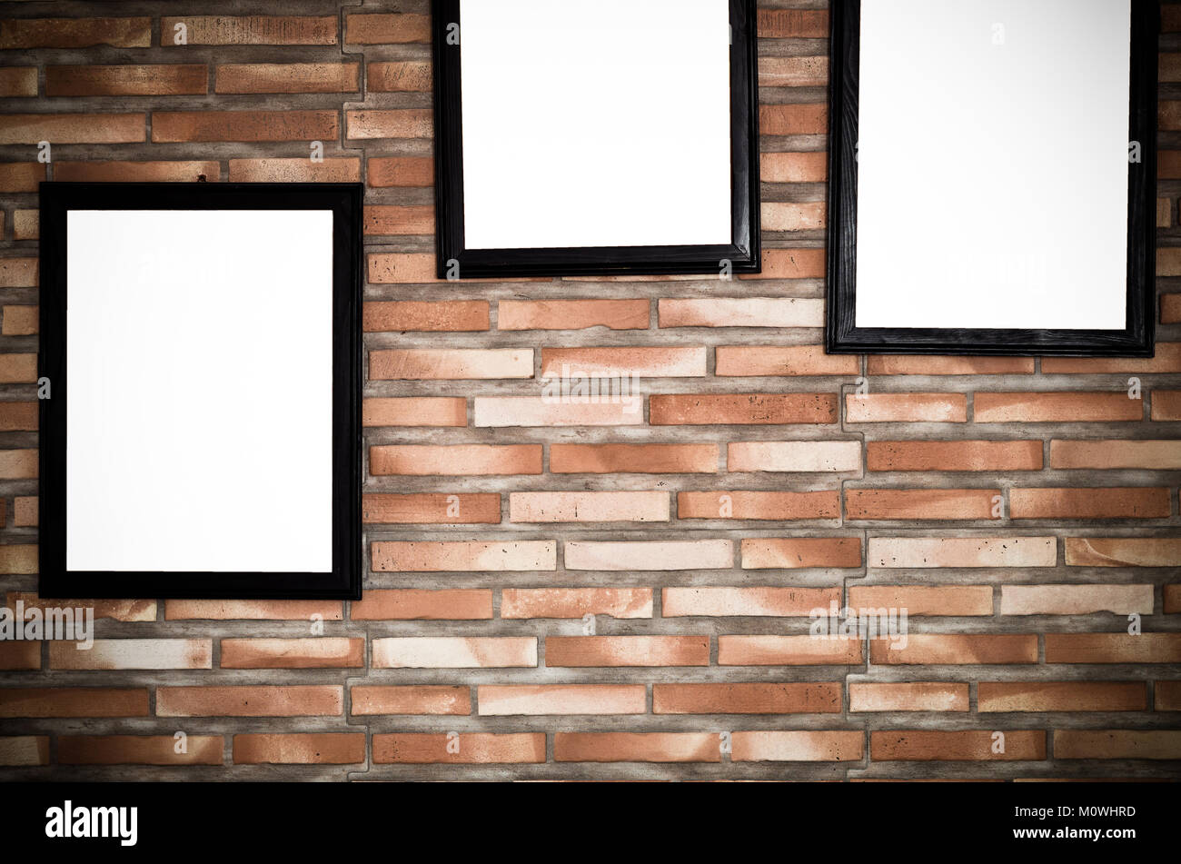 advertise frame on brick wall background Stock Photo - Alamy