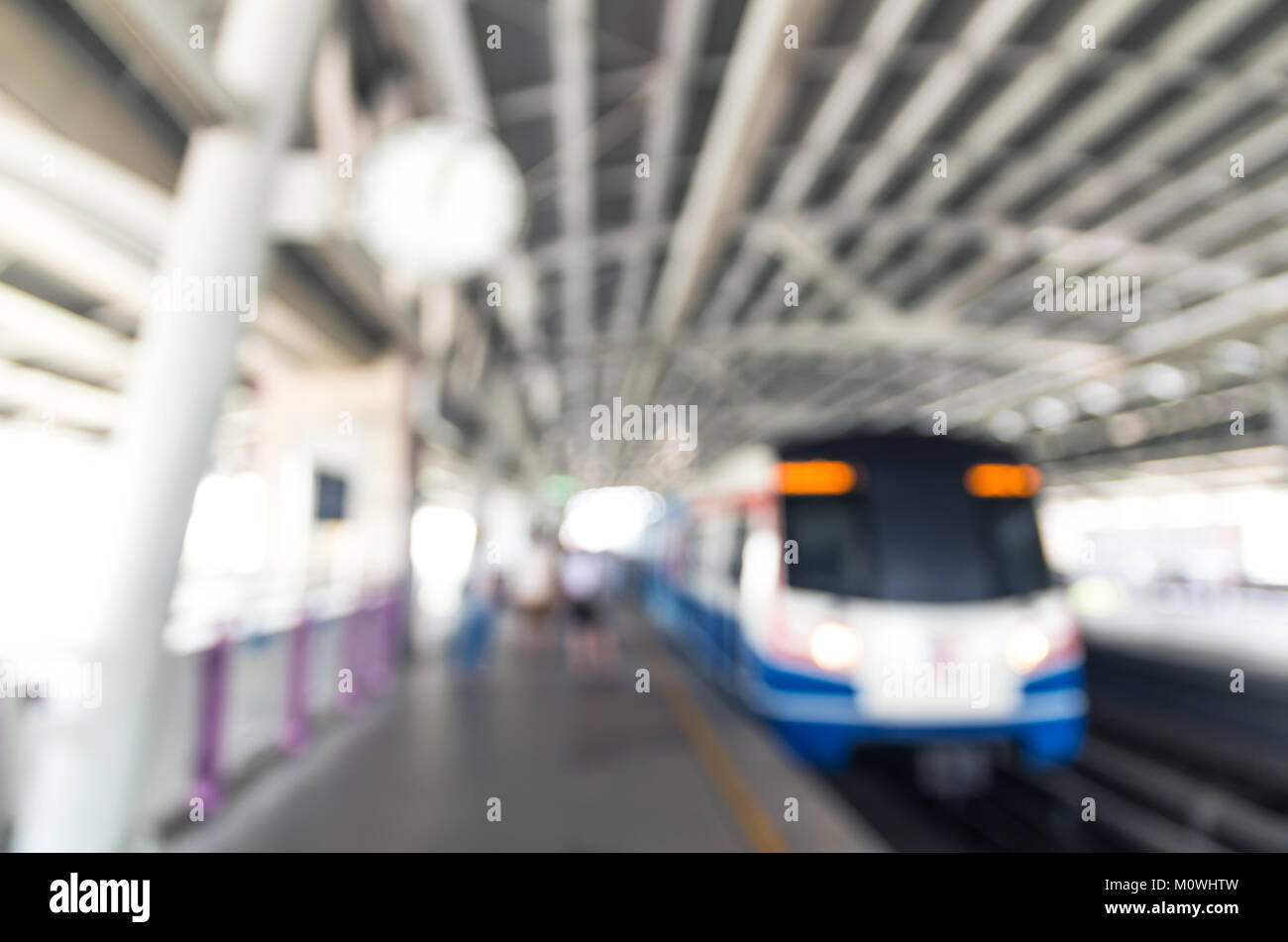 Abstract blurred photo of sky train station with people background ...