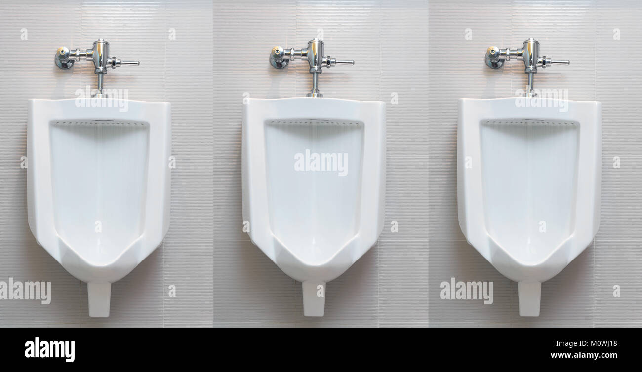 Urinal in male restroom Stock Photo - Alamy