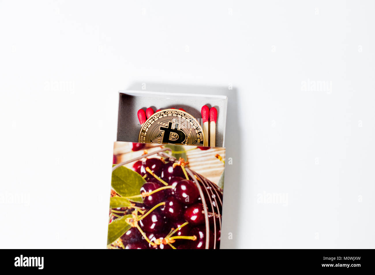 bitcoin electronic coin inside a matchbox white background Stock Photo ...