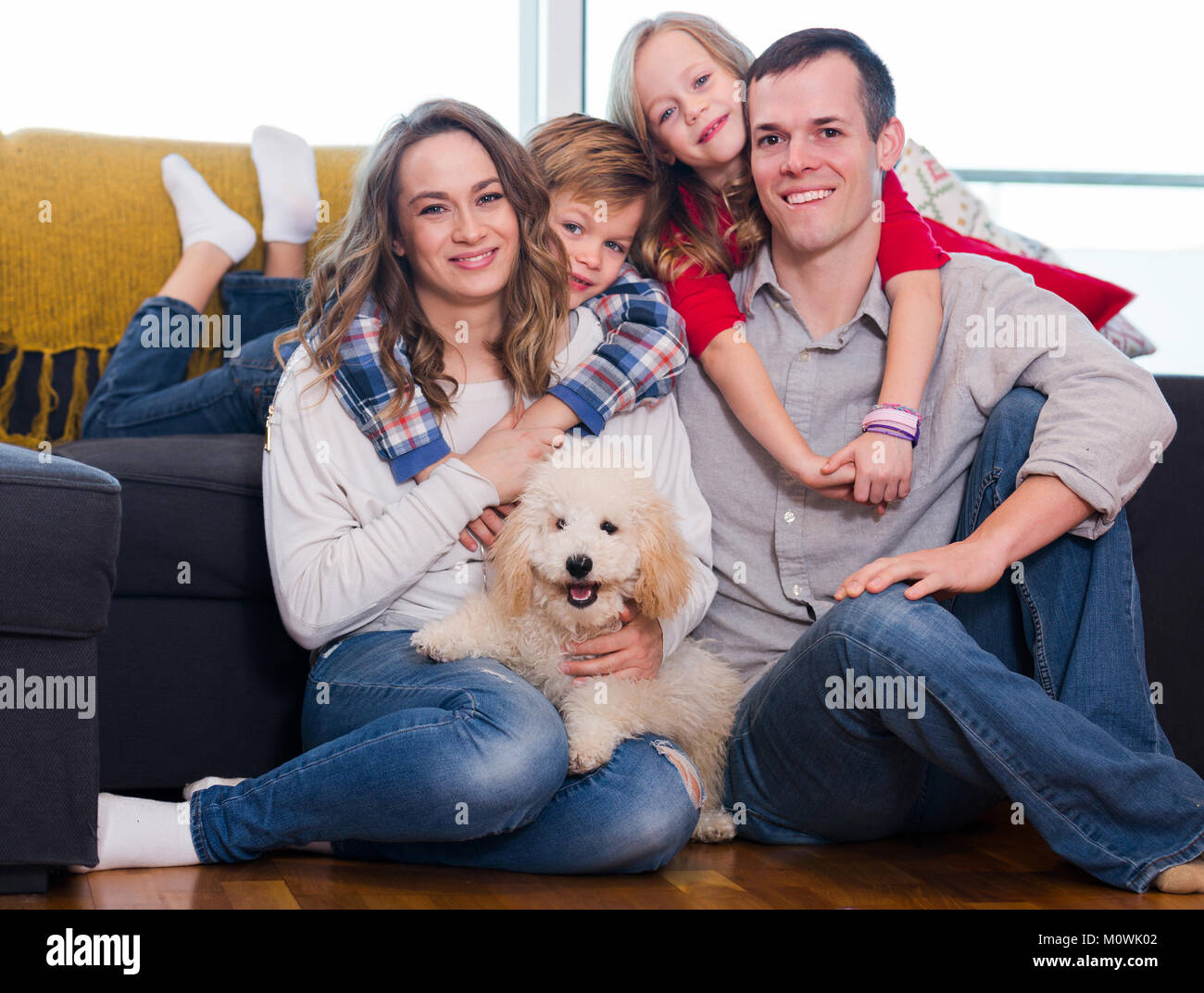 Adult family enjoying evening together at home Stock Photo - Alamy